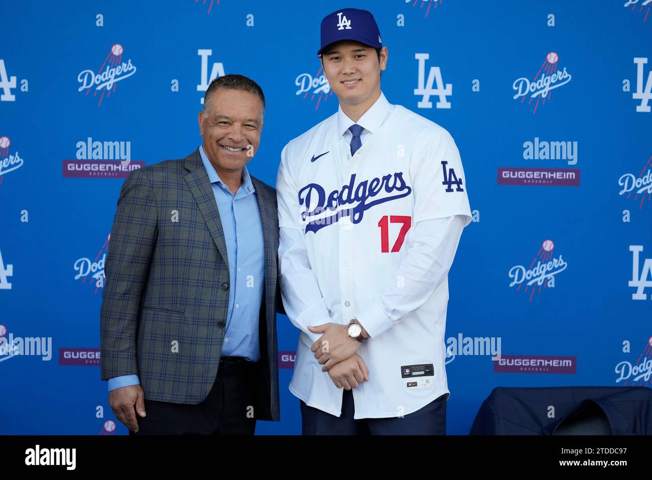Los Angeles Dodgers' Shohei Ohtani, right, stands for photos with manager Dave Roberts during a ...