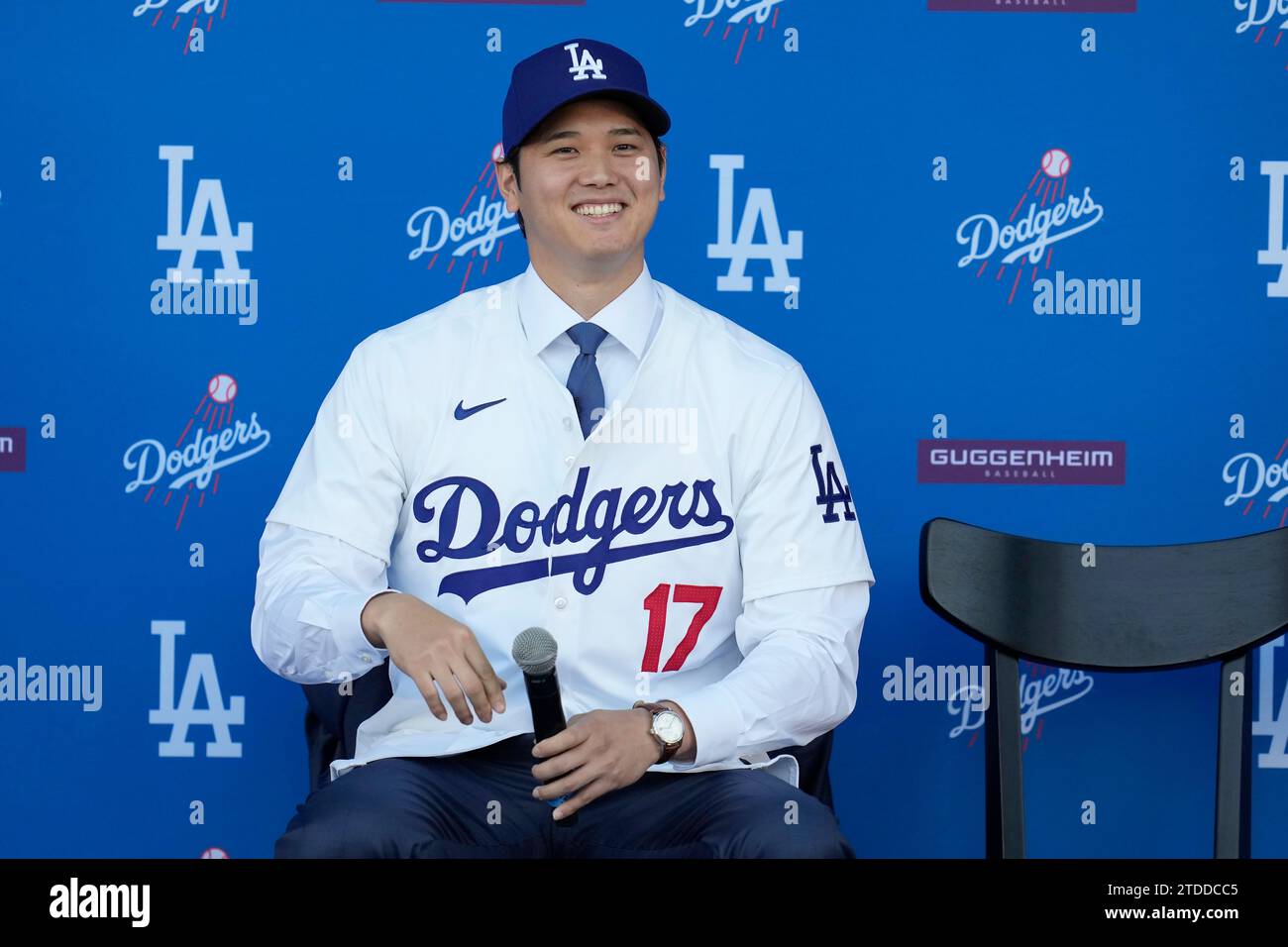 Los Angeles Dodgers' Shohei Ohtani smiles during a baseball news ...