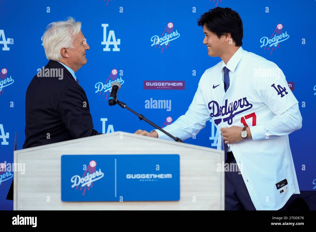 Los Angeles Dodgers' Shohei Ohtani, right, shakes hands with owner and ...