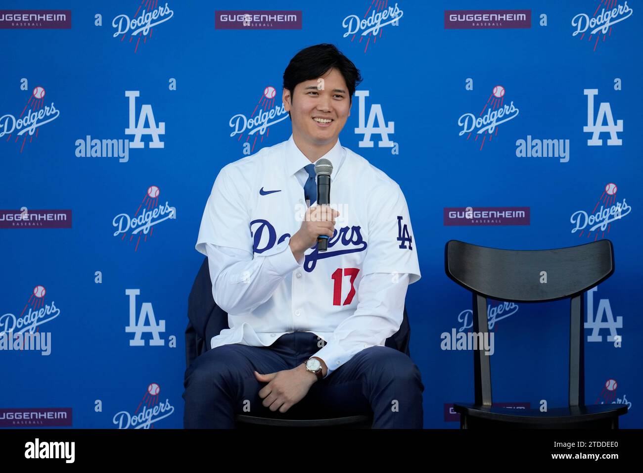Los Angeles Dodgers' Shohei Ohtani answers questions during a baseball ...