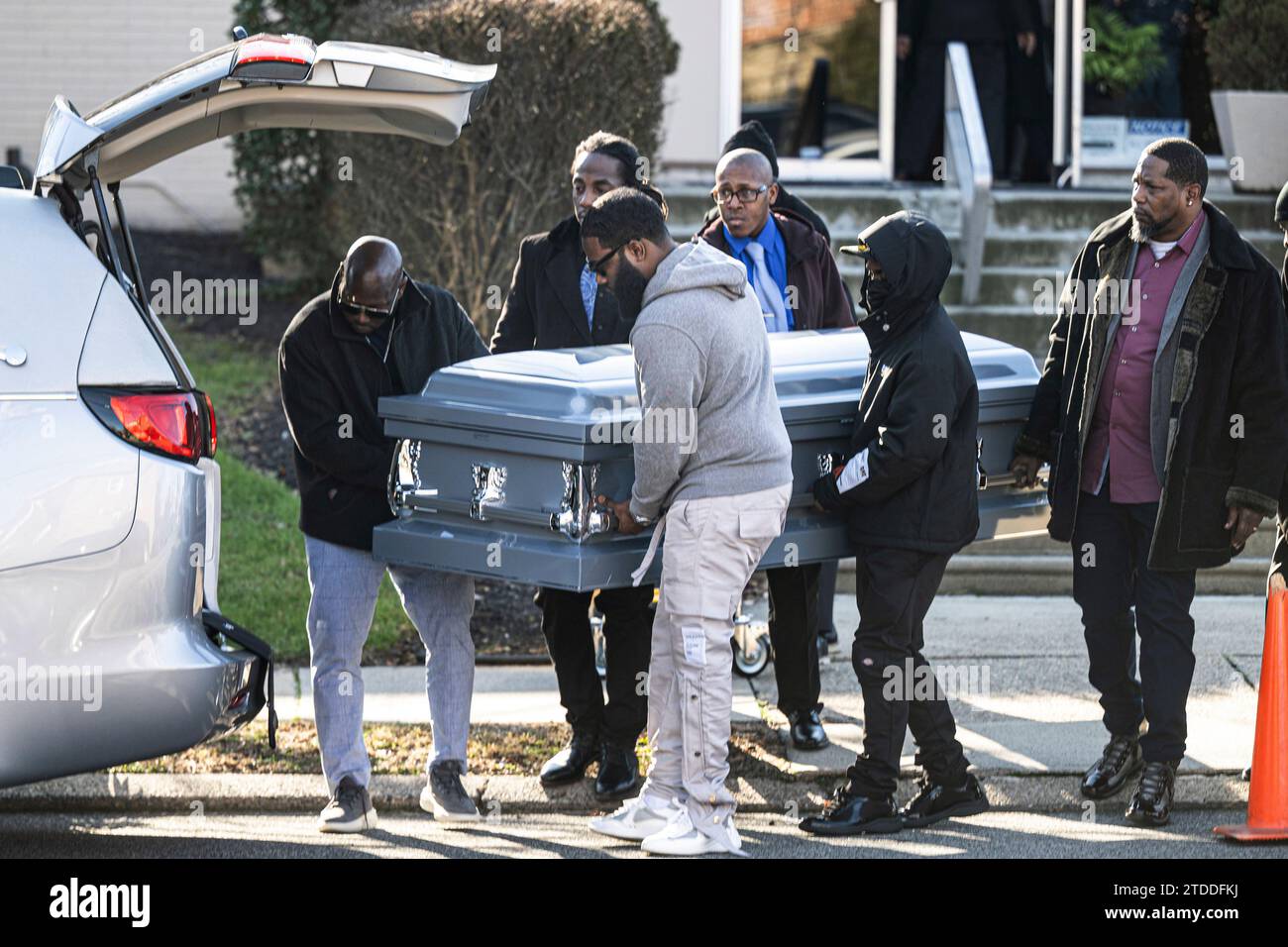 Pallbearers carry the casket of Eric Harrison, during his funeral on ...