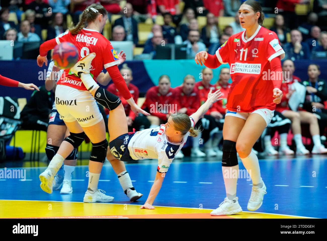 Norway's Stine Oftedal, center, is tackled in the IHF World Women's ...