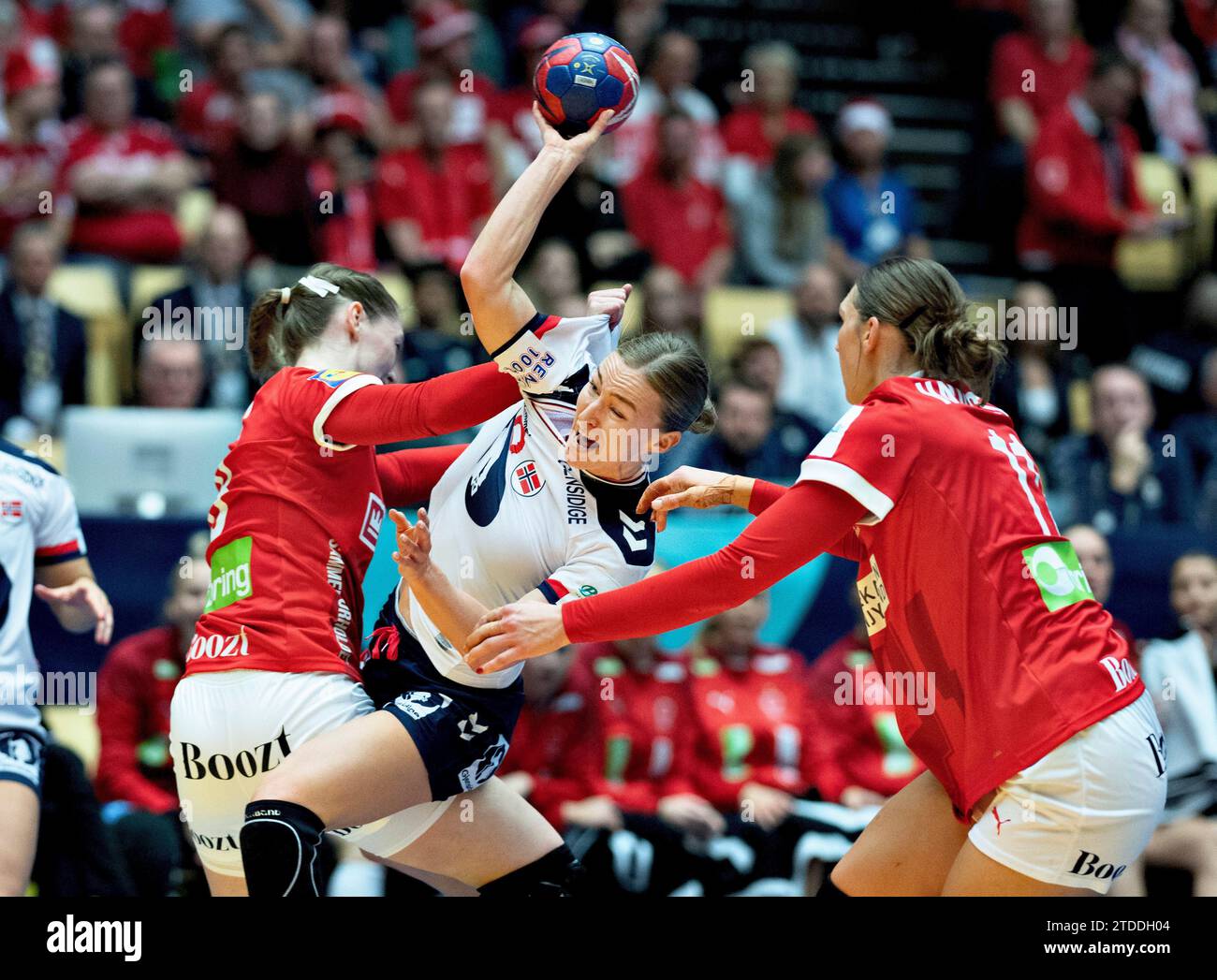 Norway's Stine Oftedal, center and Denmark's Anne Mette Hansen, left ...