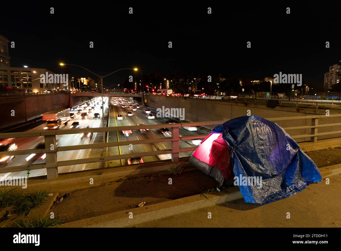 FILE - In this photo illuminated by an off-camera flash, a tarp covers ...