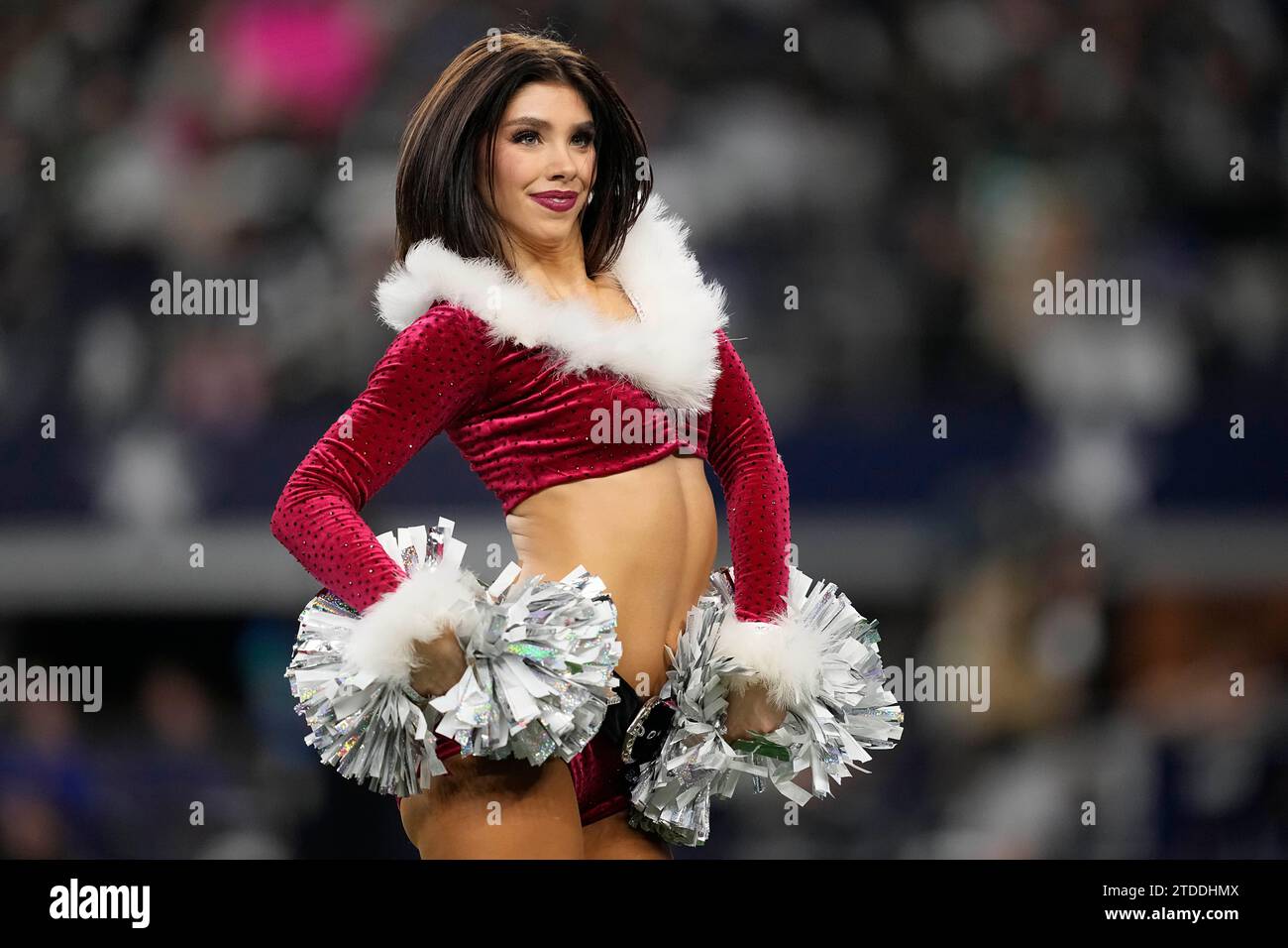 A Dallas Cowboys Cheerleader performs during the second half of an NFL ...