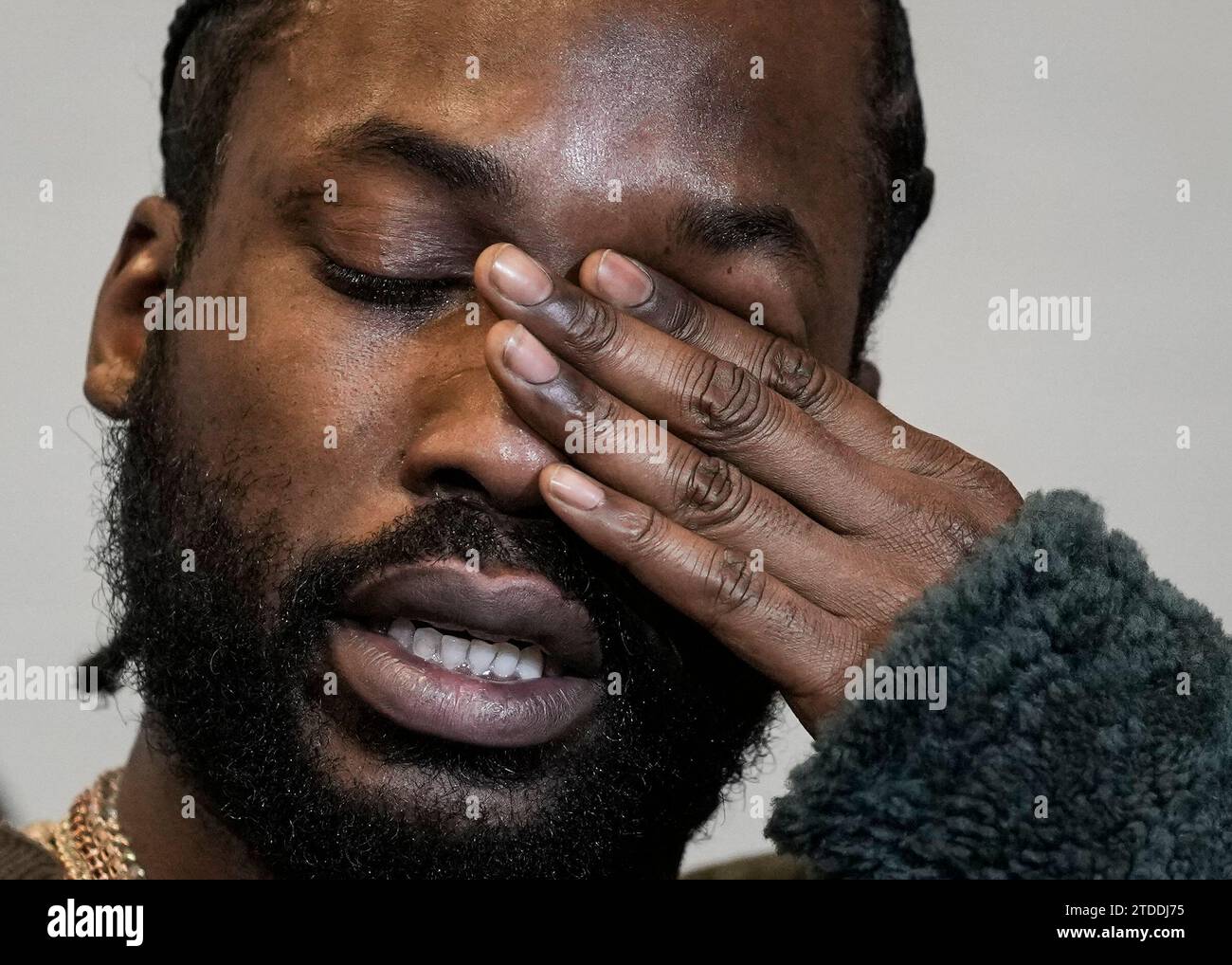Rapper Meek Mill wipes his eyes as he speaks during a ceremonial bill ...