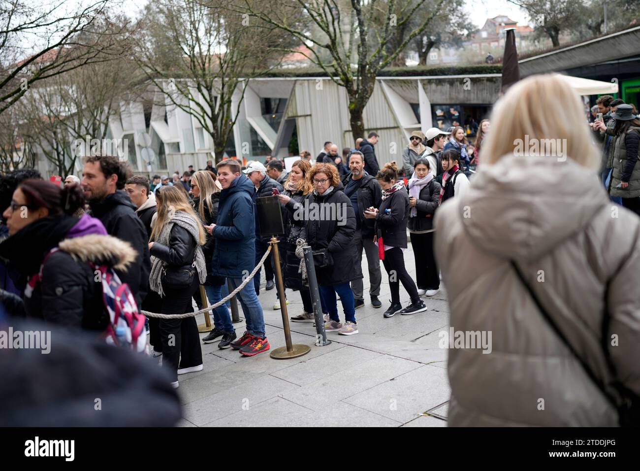 Tourists queue to visit the Lello bookshop, opened in1881, in Porto ...