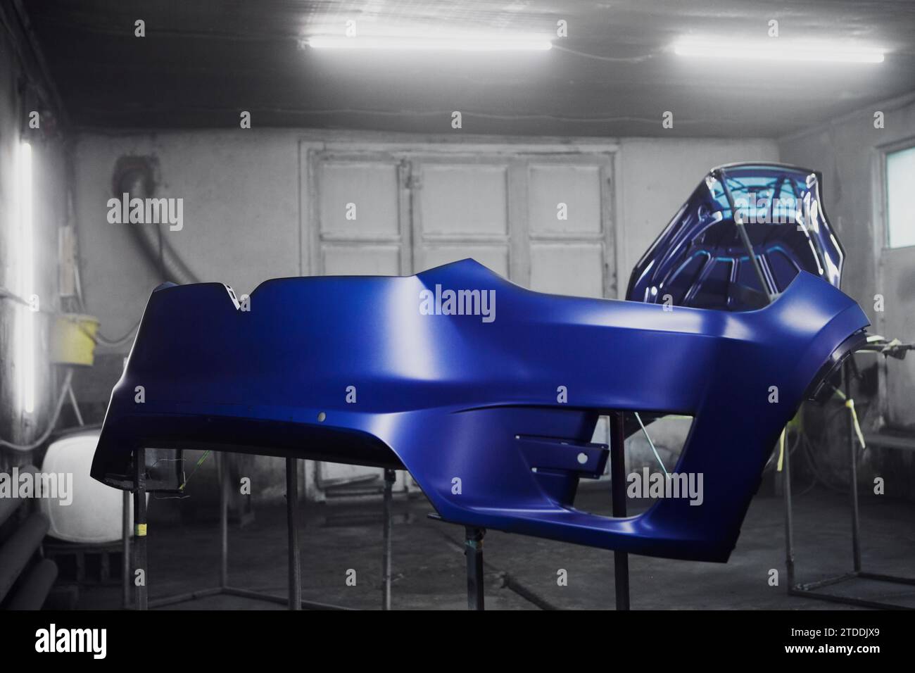 Painted car bumper in auto service. Restoration painting of automobile ...