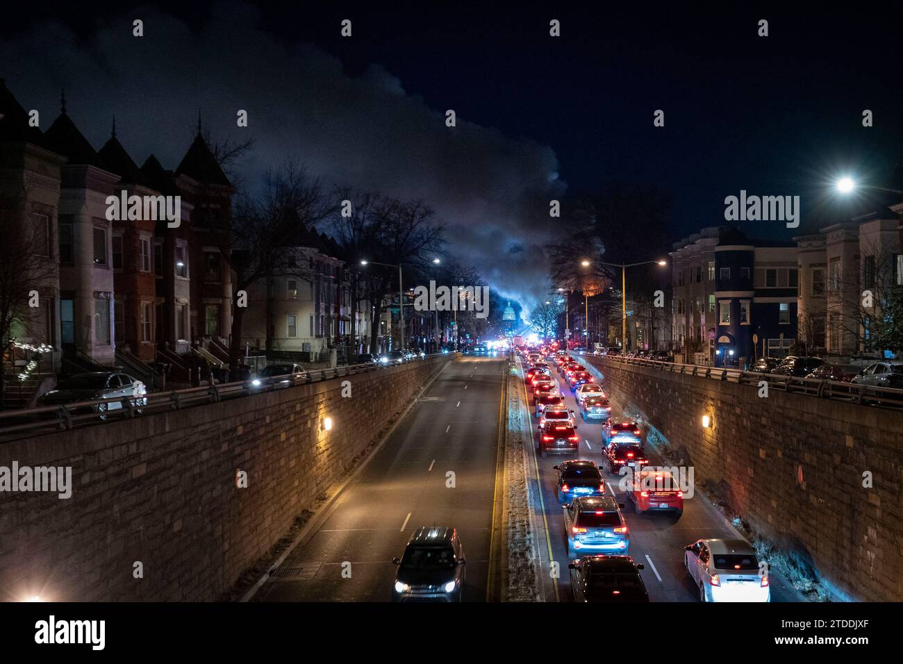 The Dome of the U.S. Capitol Building is visible through smoke, as ...