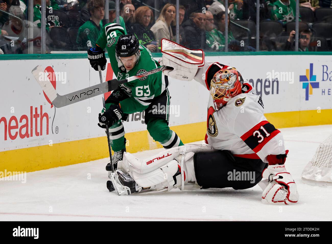 Dallas Stars right wing Evgenii Dadonov (63) tries to get the puck as ...