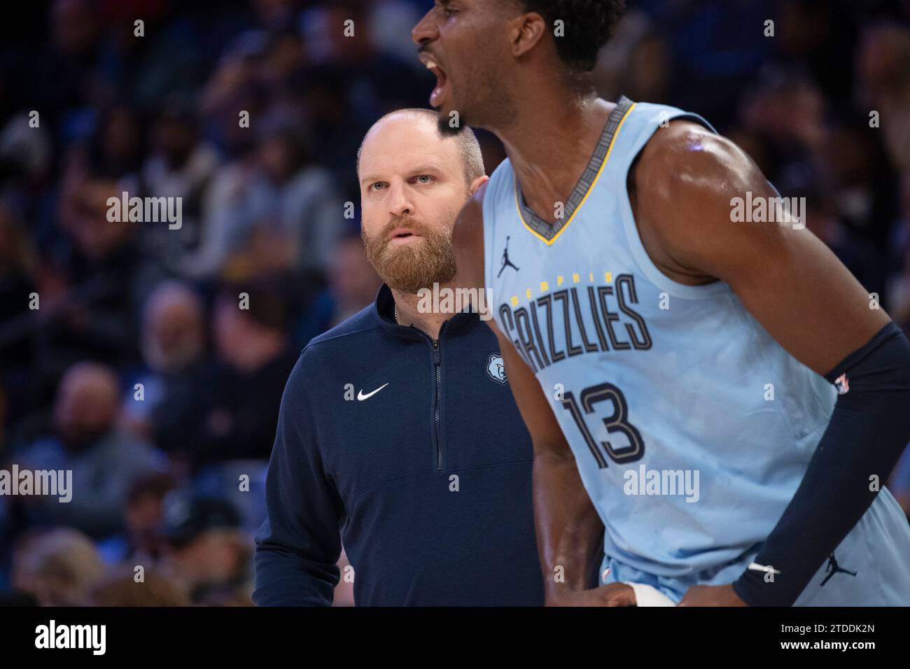 Memphis Grizzlies coach Taylor Jenkins listens as forward Jaren Jackson ...