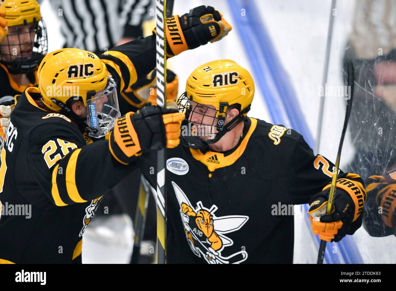 American International left wing John Lundy, right, celebrates with ...