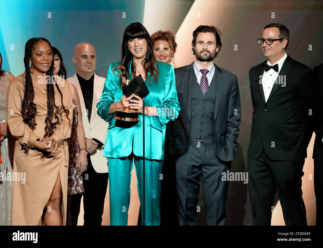 Executive producer Alex Duda, center, and the team from "The Kelly ...