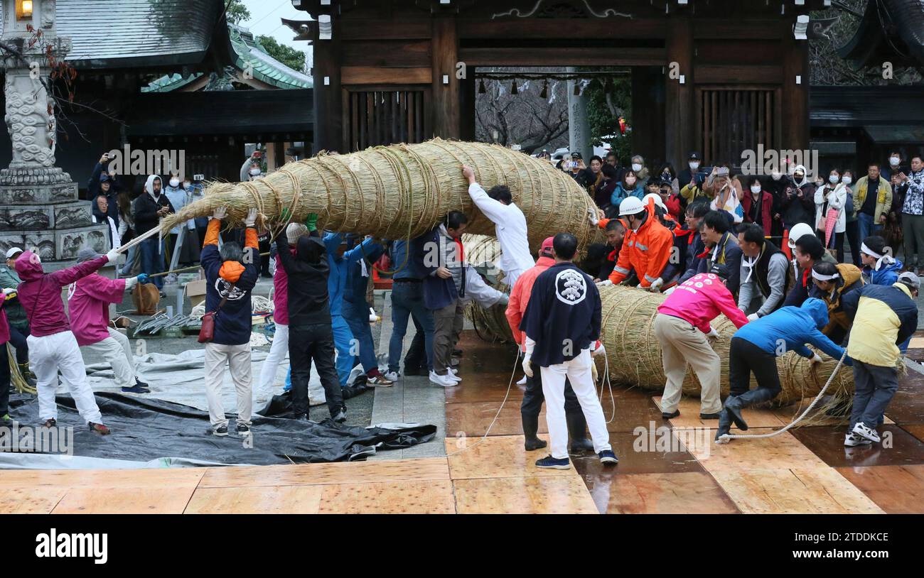 People make a largest sacred straw rope during an annual event at ...