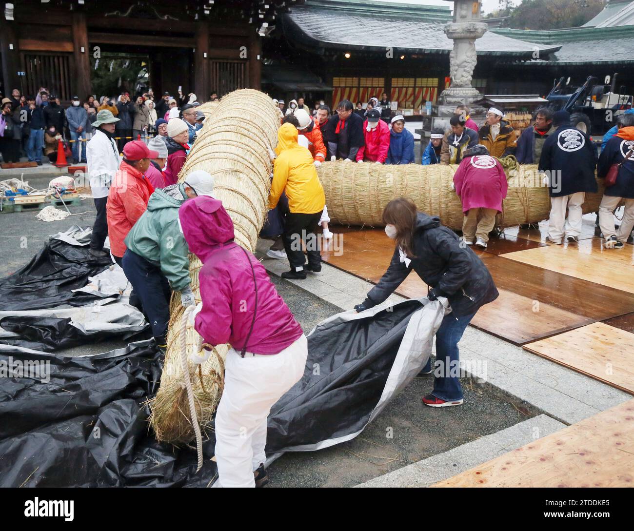 People make a largest sacred straw rope during an annual event at ...