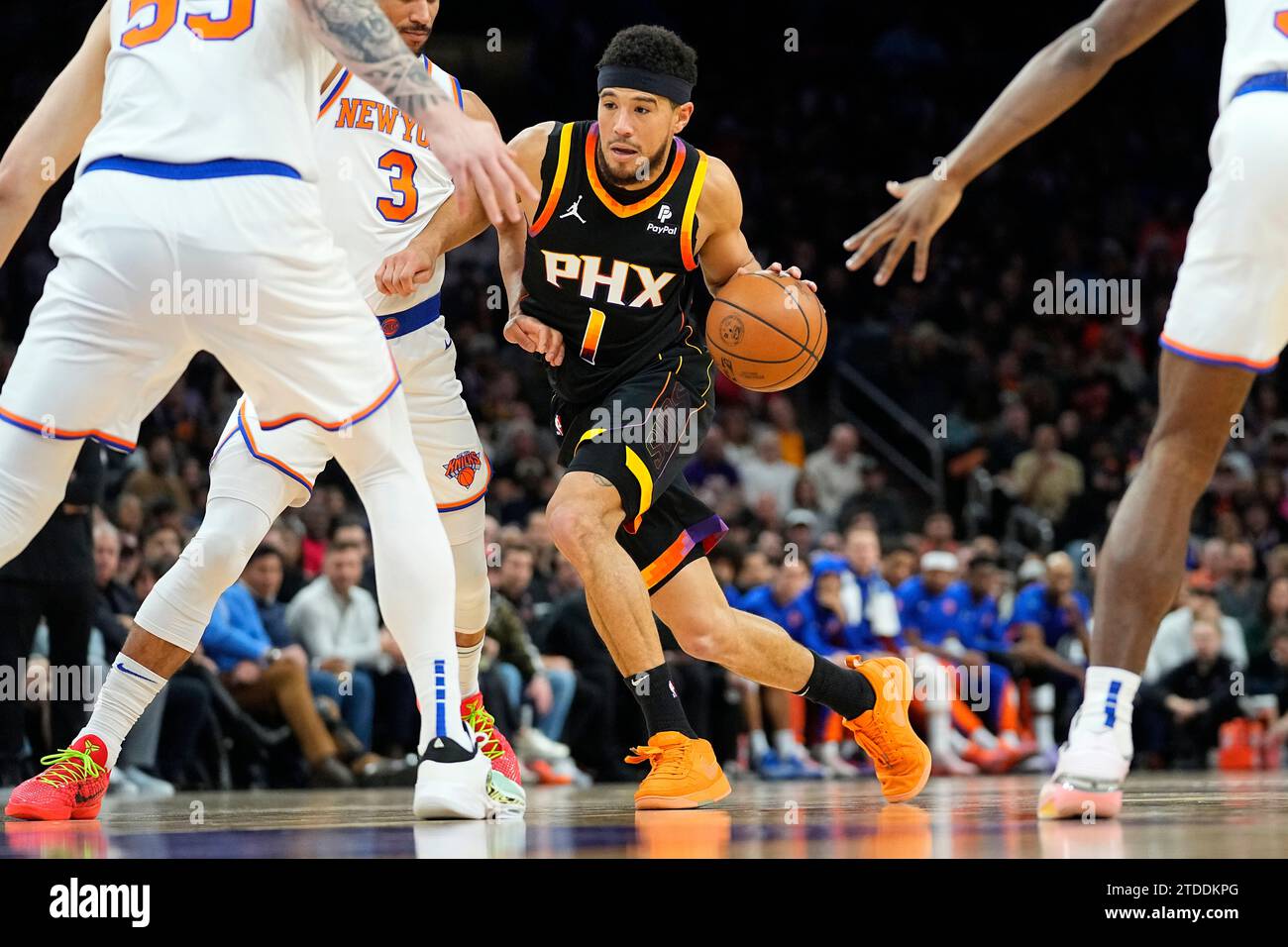 Phoenix Suns guard Devin Booker (1) drives as New York Knicks guard Josh Hart (3) defends during ...