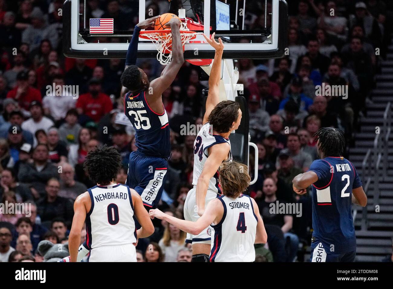UConn forward Samson Johnson (35) dunks next to Gonzaga forward Braden ...