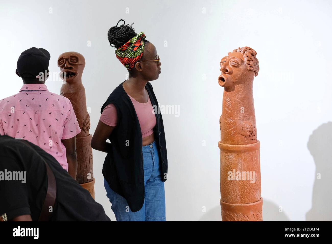 A lady looks at a sculpture piece during Lilian Nabulime's "Olugamba ...