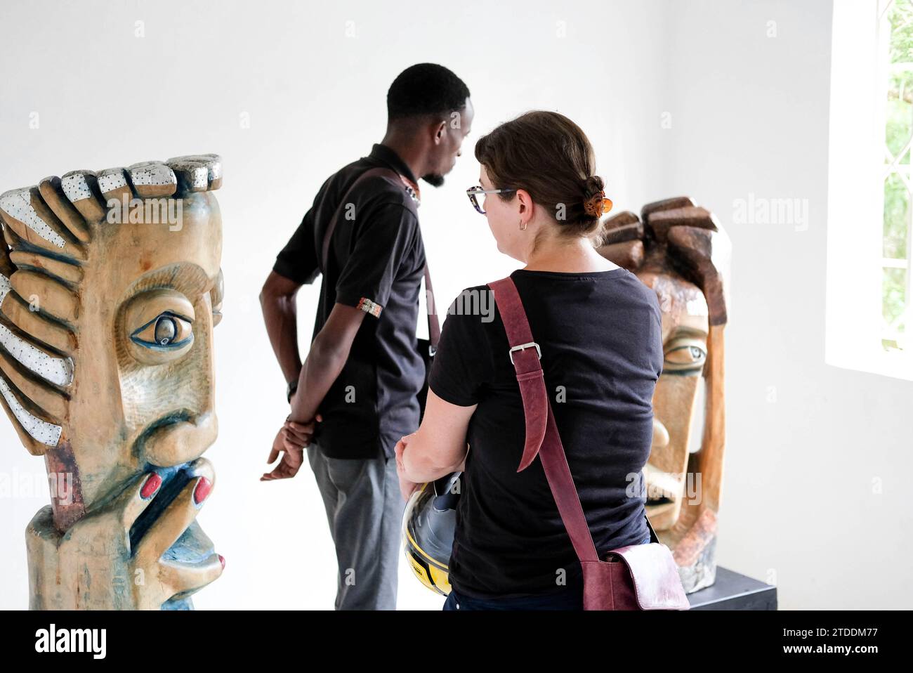 A lady looks at a sculpture piece during Lilian Nabulime's "Olugamba ...