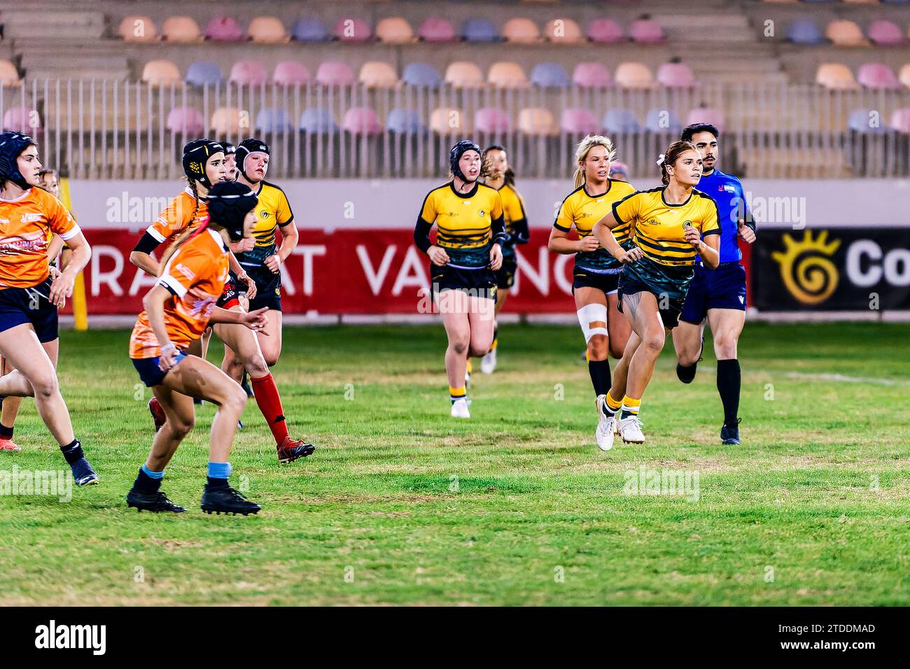 Women running in rugby match Stock Photo - Alamy