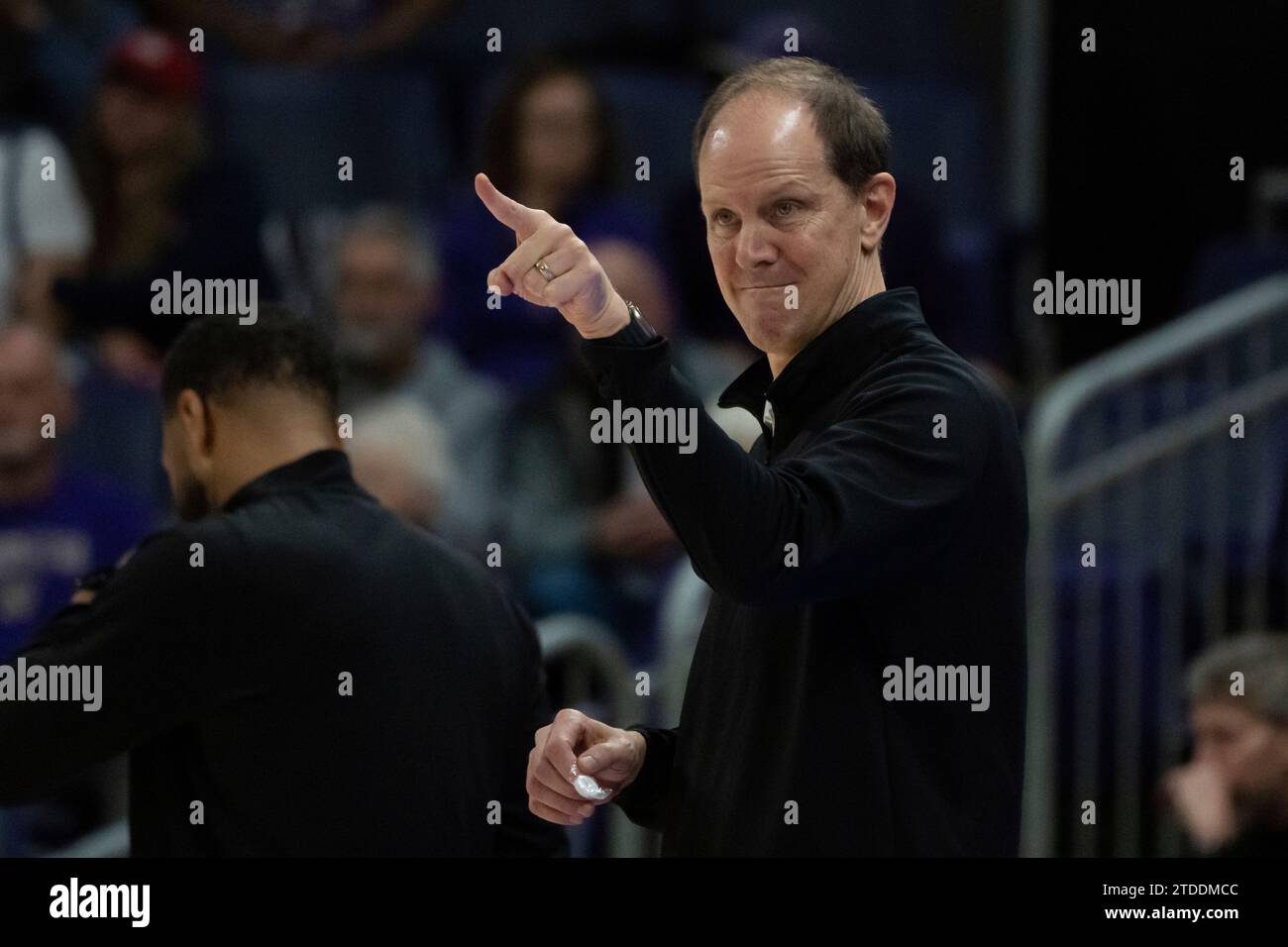 Washington head coach Mike Hopkins gestures to his team during an NCAA ...