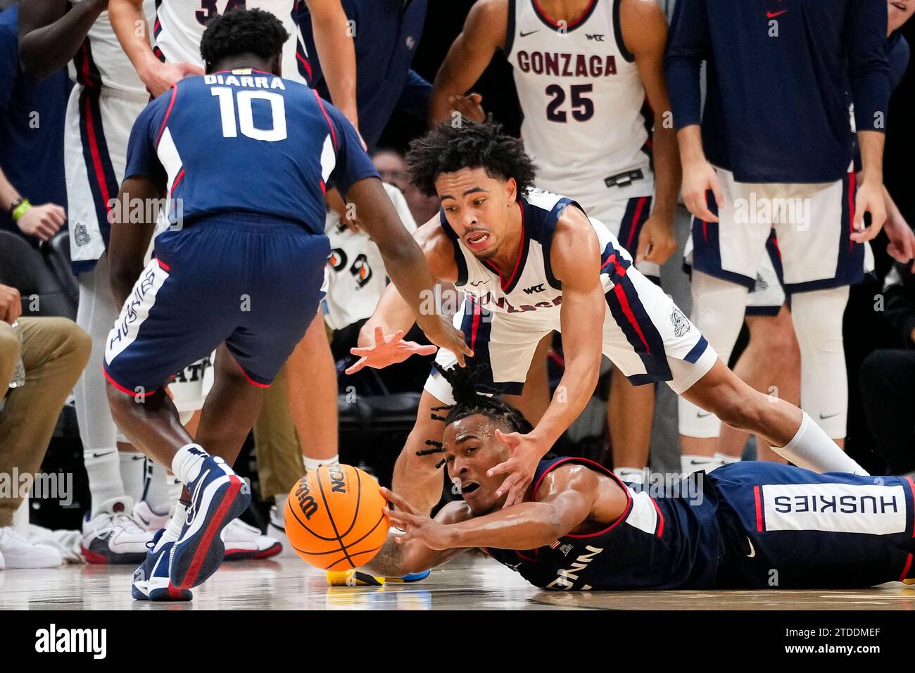 UConn guard Stephon Castle reaches out for the ball as he falls to the ...