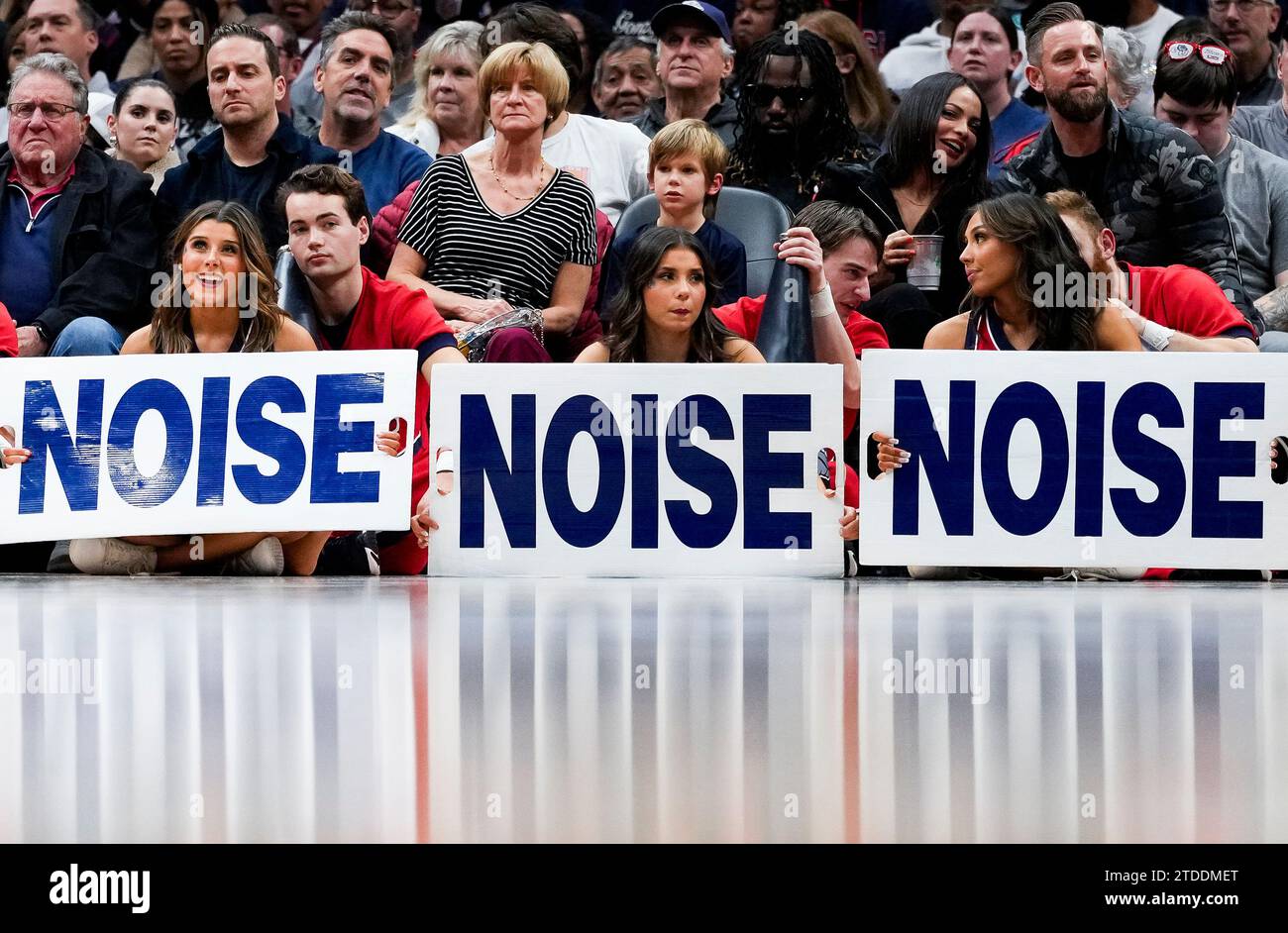 Members Of The Gonzaga Cheer Team Hold Noise Signs As Gonzaga Trailed