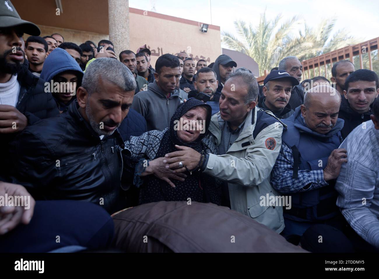 Relatives of the Al Jazeera cameraman, Samer Abu Daqqa, who was killed by an Israeli airstrike ...