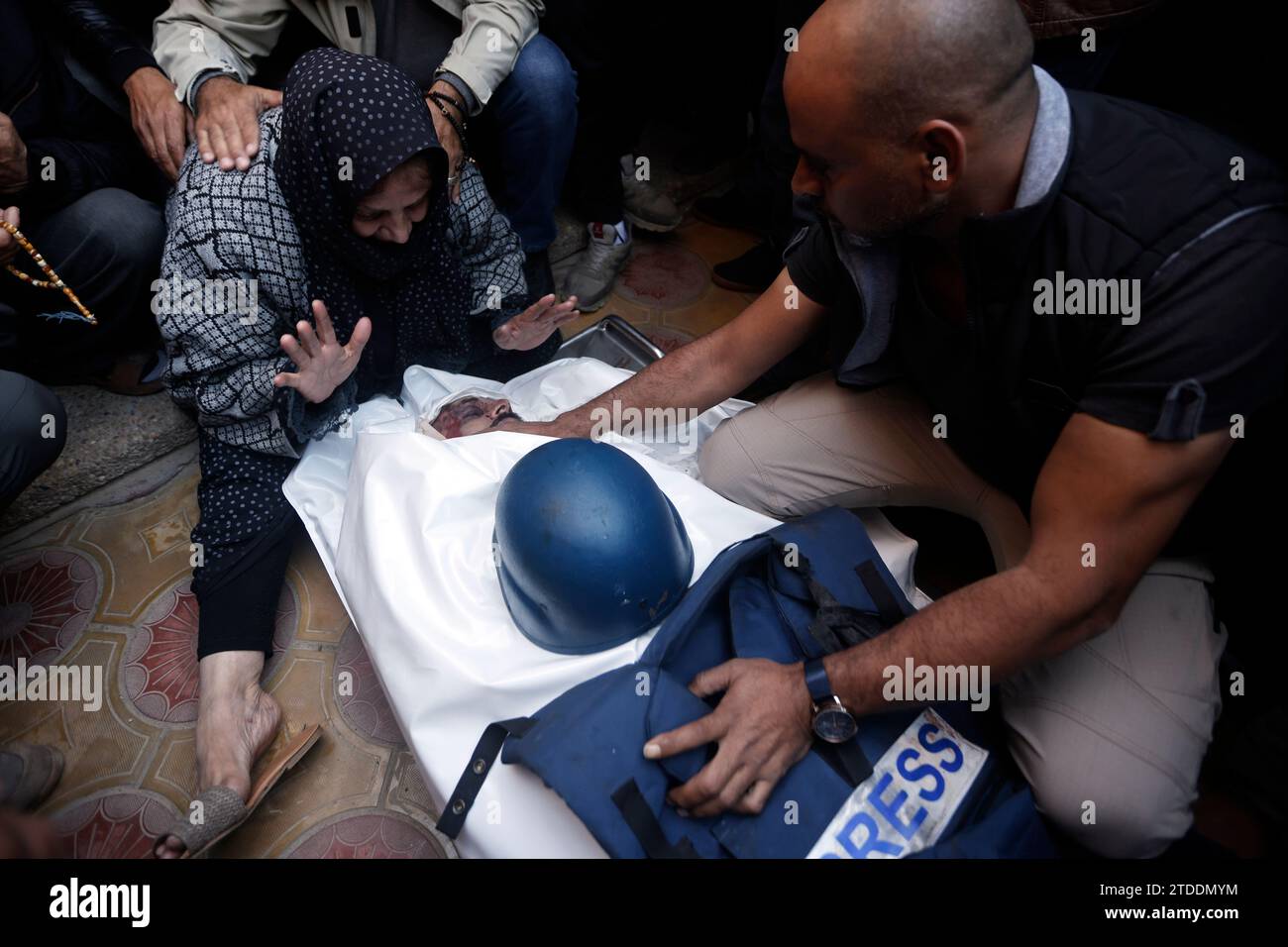 Relatives of the Al Jazeera cameraman, Samer Abu Daqqa, who was killed by anIsraeli airstrike ...