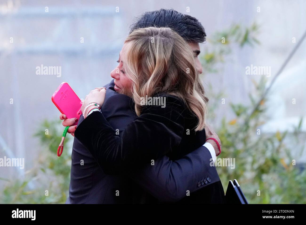 Italy's Prime Minister Giorgia Meloni hugs Britain's Prime Minister ...