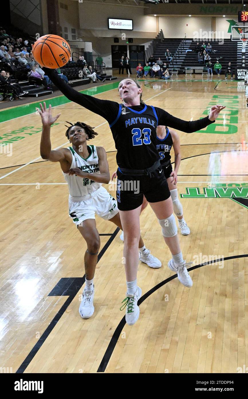 Mayville State Comets Guard Jordan Zrust (23) pulls in a rebound during ...