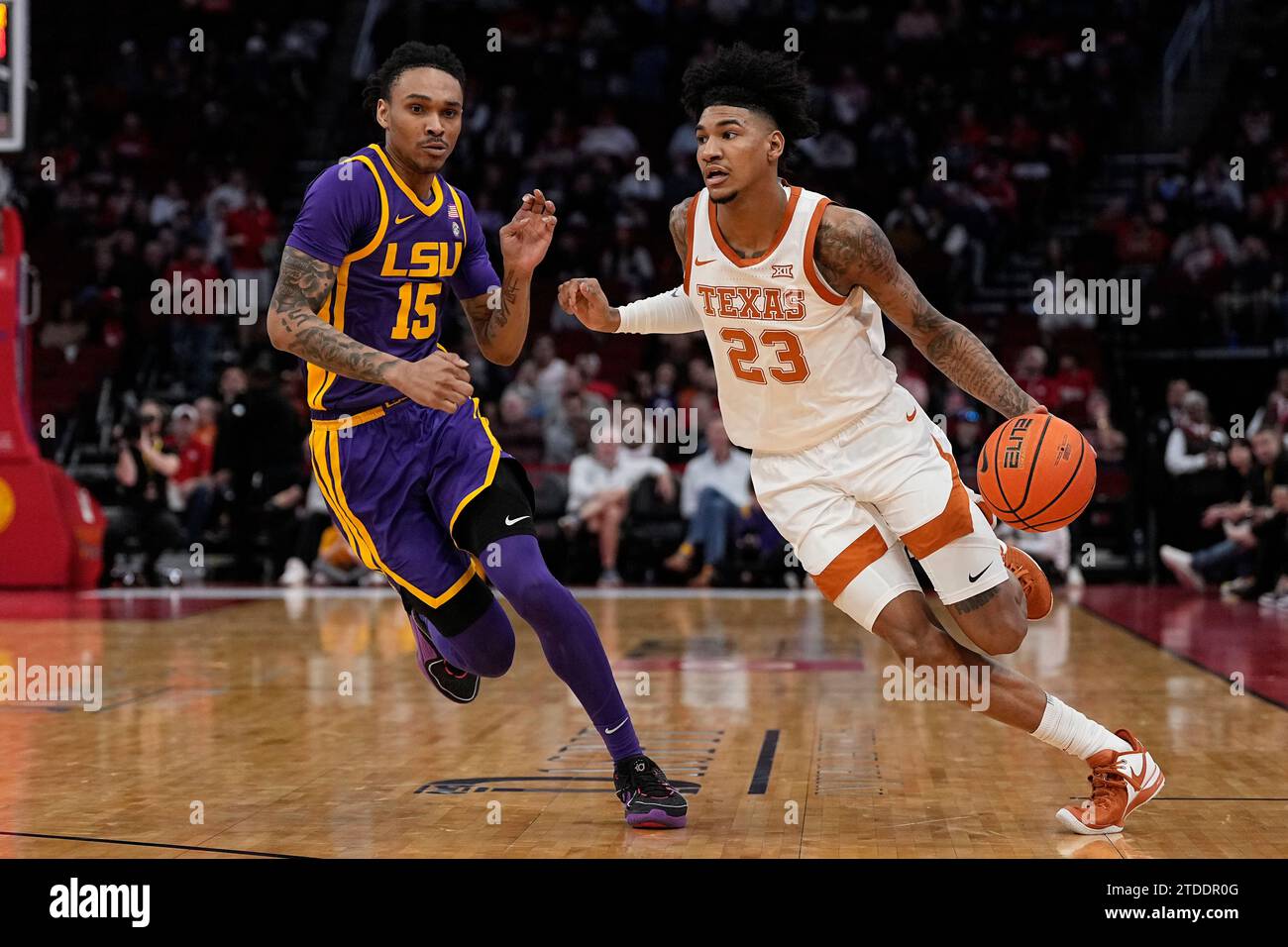 Texas forward Dillon Mitchell (23) drives around LSU forward Tyrell ...