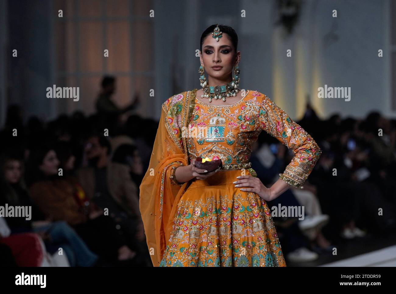 A model presents a creation from designer Anaya and Horain during a ...