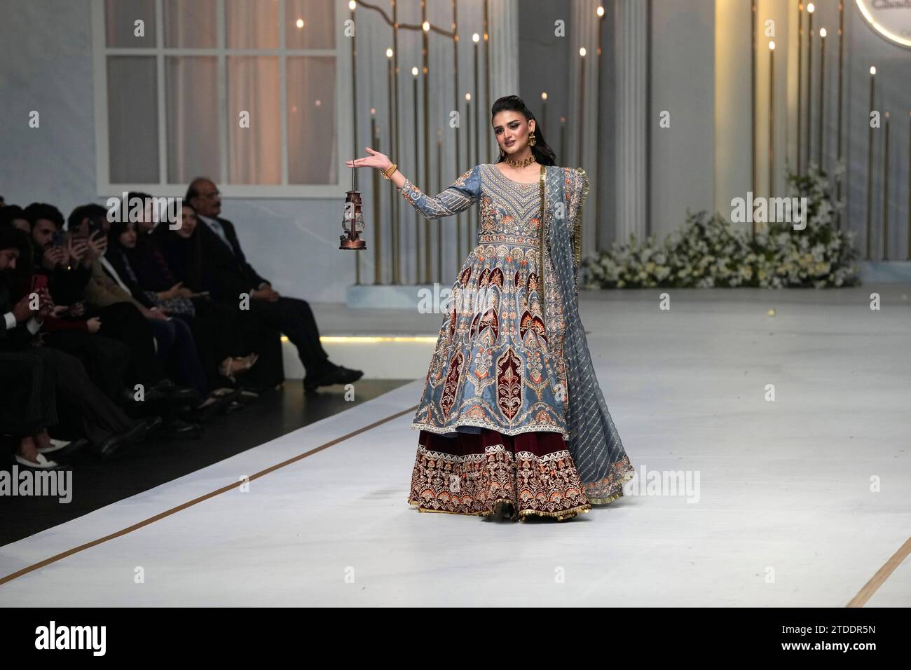 A model presents a creation from designer Anaya and Horain during a fashion show of Bridal ...