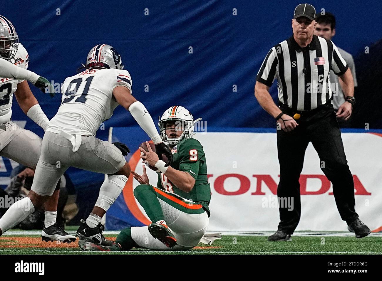 Howard defensive lineman Noah Miles (91) hits Florida A&M quarterback ...