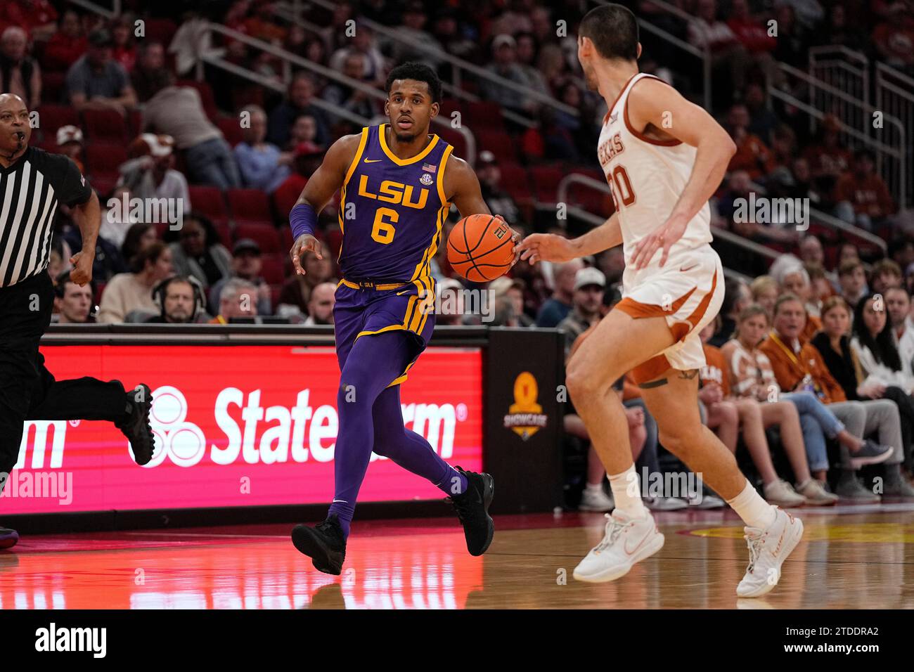 LSU guard Jordan Wright (6) is paced up court by Texas forward Brock ...