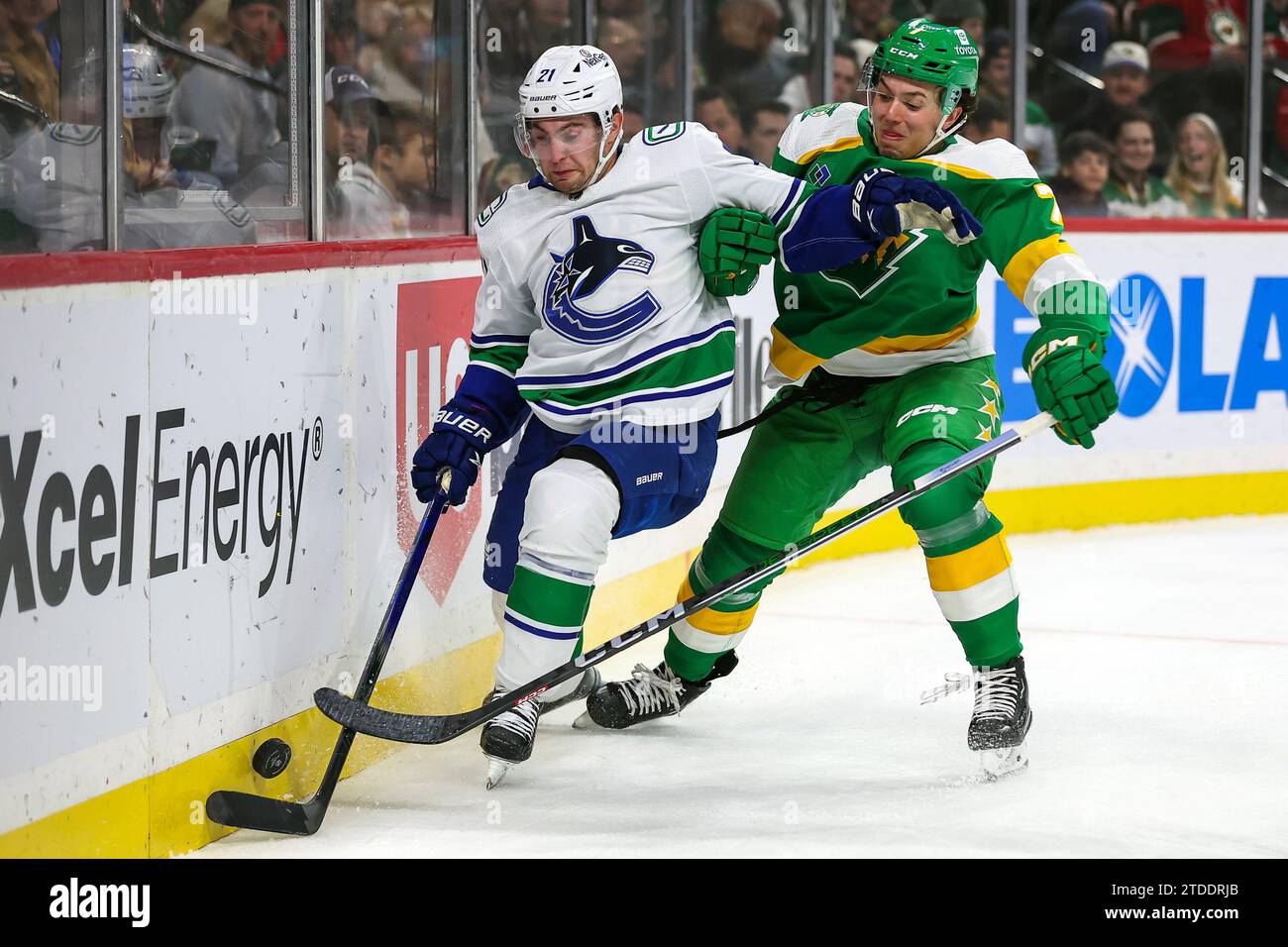 Vancouver Canucks left wing Nils Hoglander, left, and Minnesota Wild ...