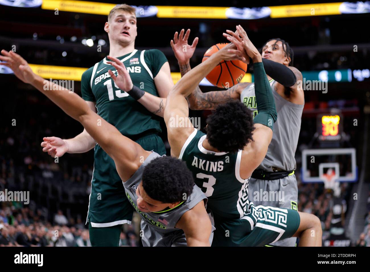 Michigan State guard Jaden Akins (3) and center Carson Cooper, left ...