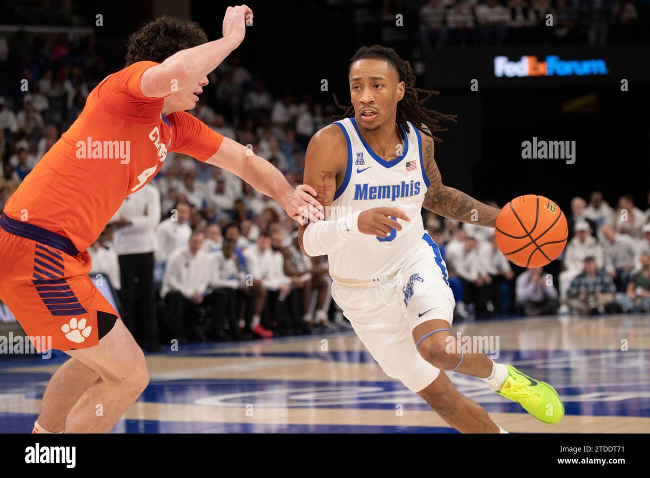 Clemson forward Ian Schieffelin (4) defends Memphis guard Caleb Mills ...