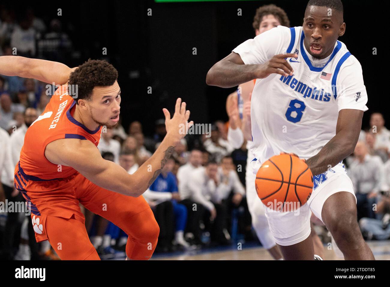 Memphis forward David Jones (8) slips the defense of Clemson guard ...