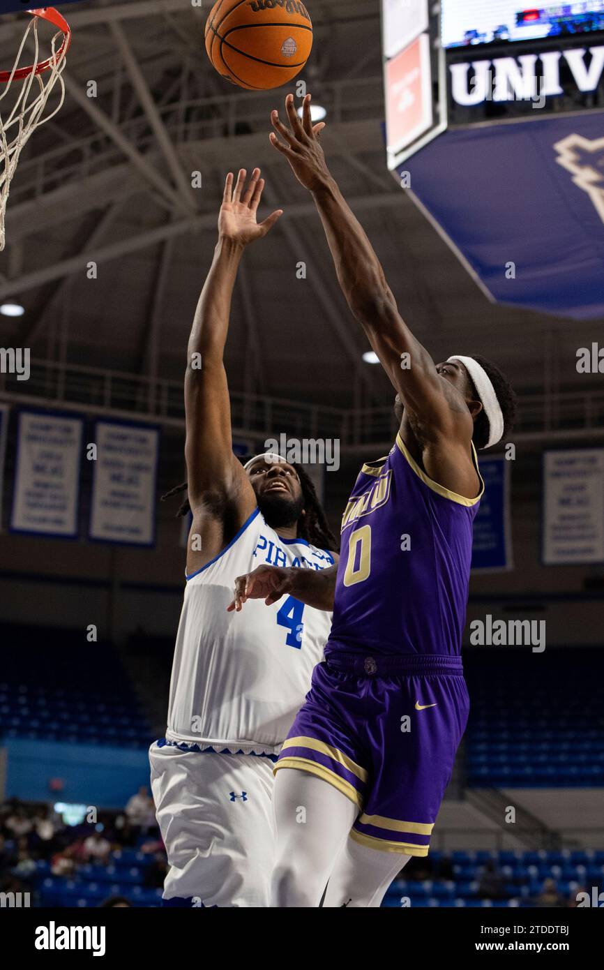 James Madison guard Xavier Brown (0) attempts a shot against Hampton ...