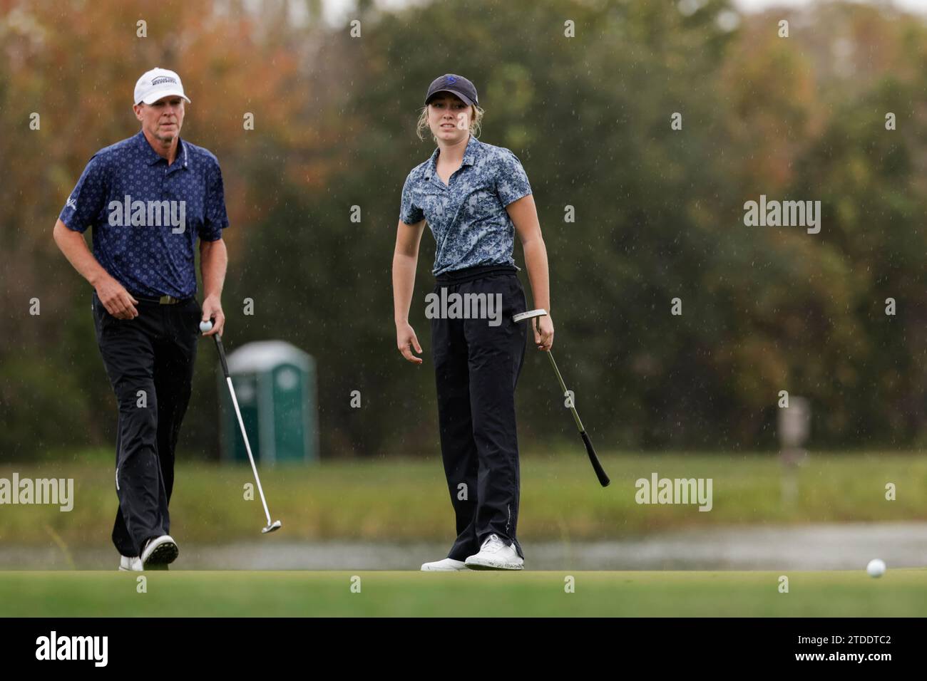 Izzi Stricker, right, reacts as her father Steve watches a missed putt ...