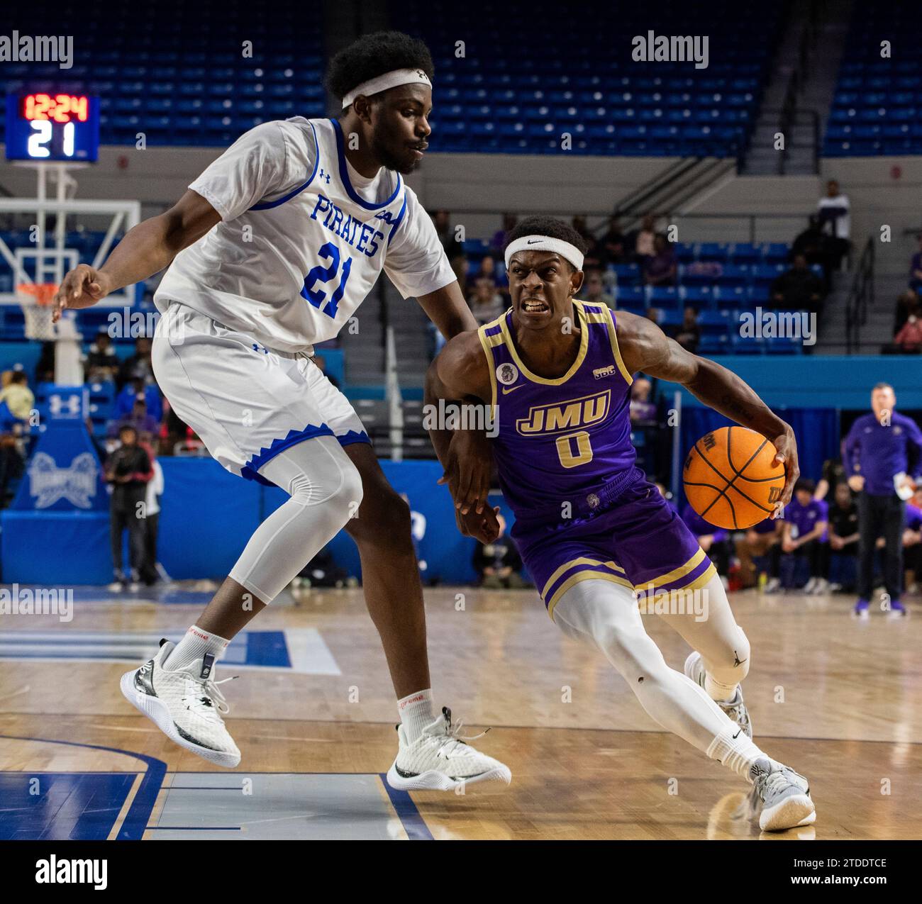 James Madison guard Xavier Brown (0) dribbles towards the basket ...