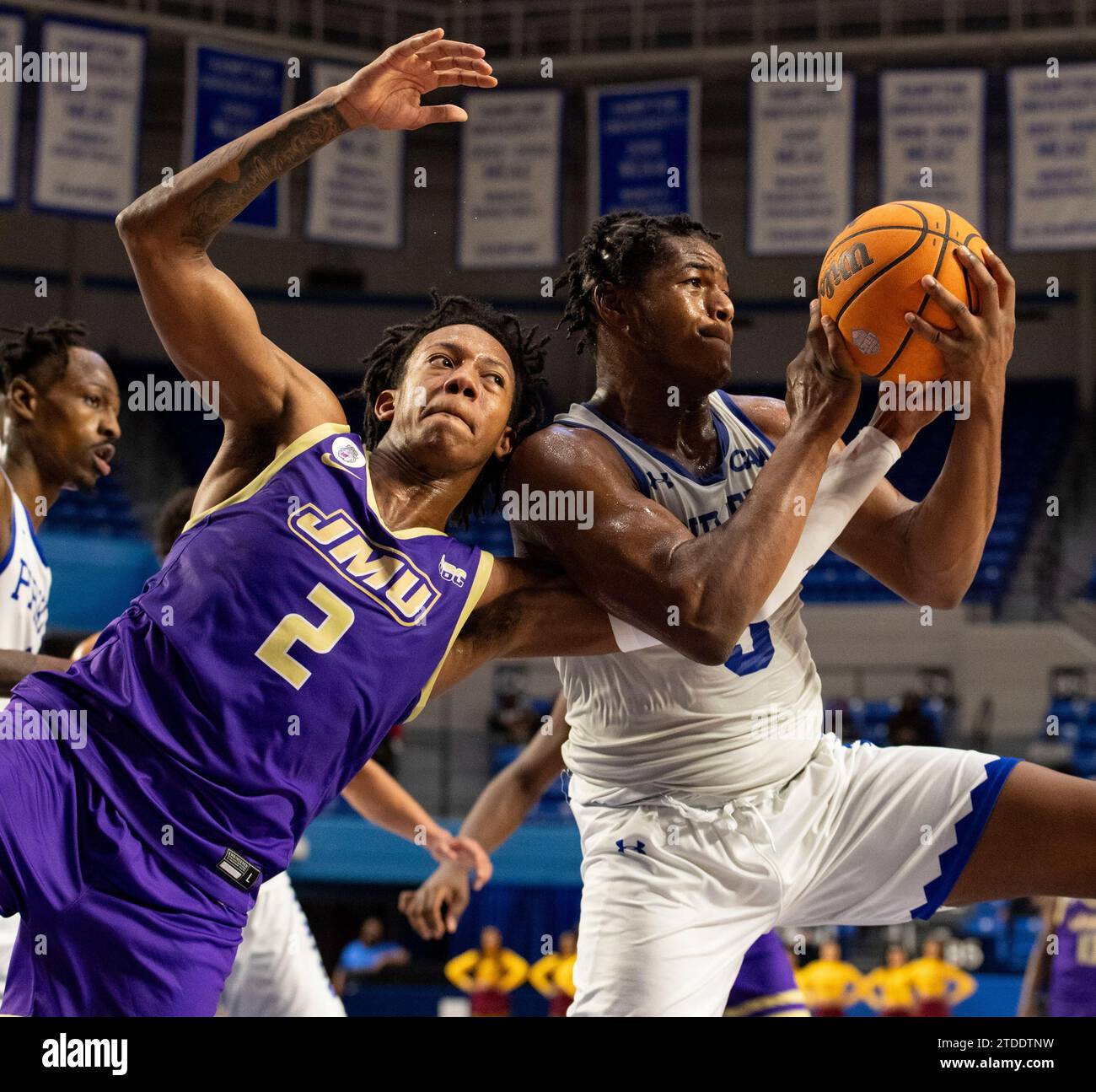 Hampton forward Kyrese Mullen, right, grabs a rebound against James ...