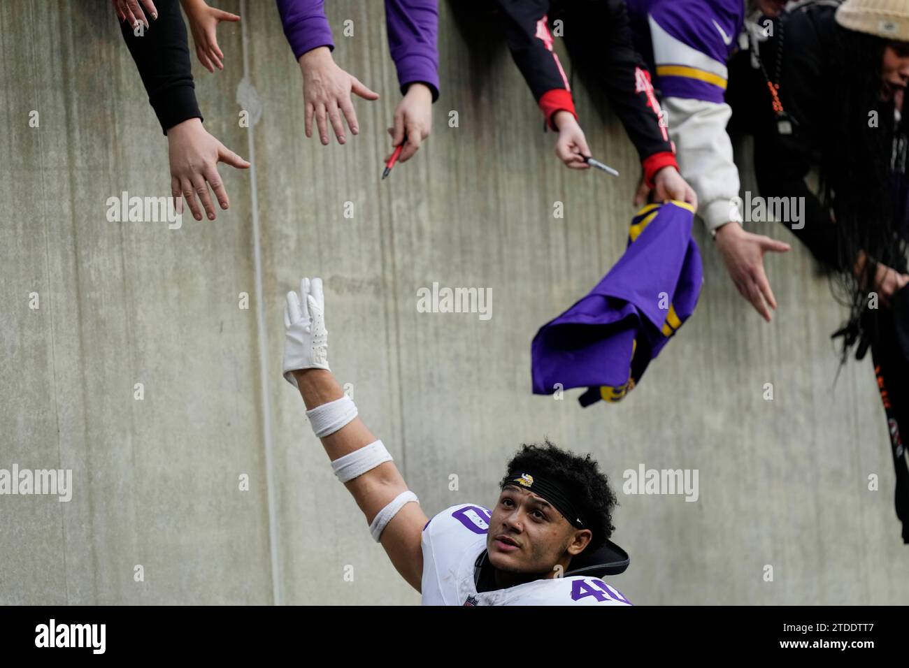 Minnesota Vikings linebacker Ivan Pace Jr. (40) high-fives fans as he ...
