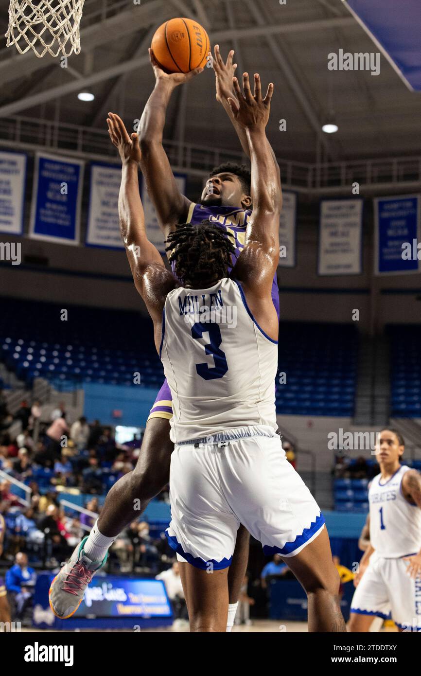 James Madison forward Jaylen Carey (15) attempts a shot over Hampton ...