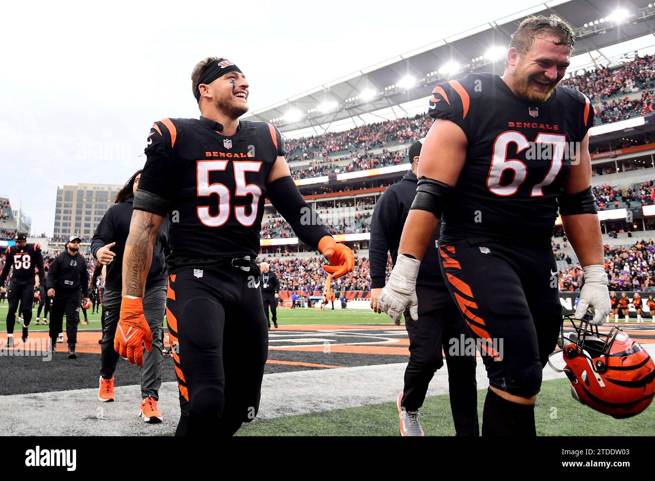 Cincinnati Bengals linebacker Logan Wilson (55) and guard Cordell Volson (67) walk off the field ...