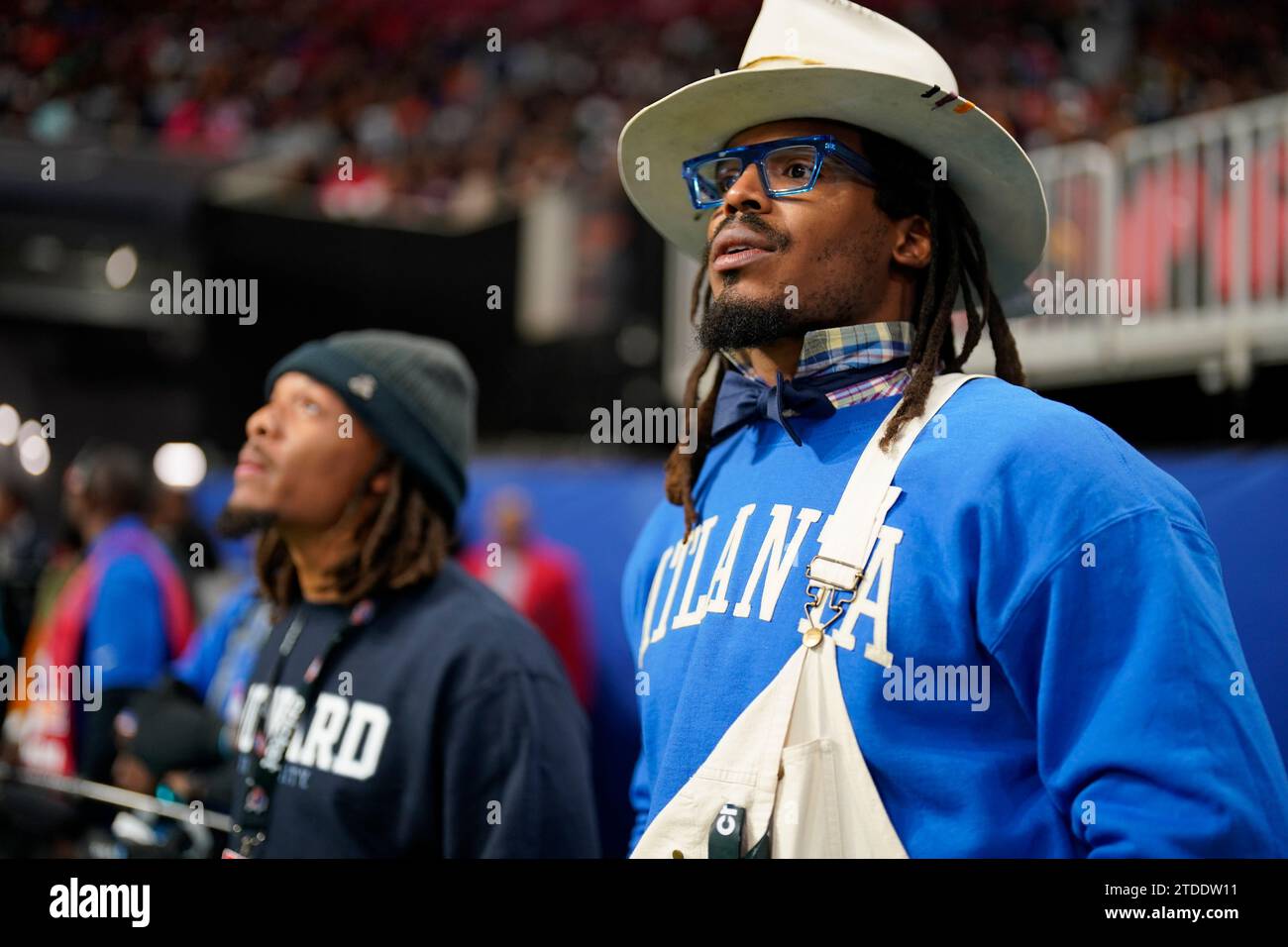NFL football player Cam Newton, right, and brother Caylin Newton watch ...