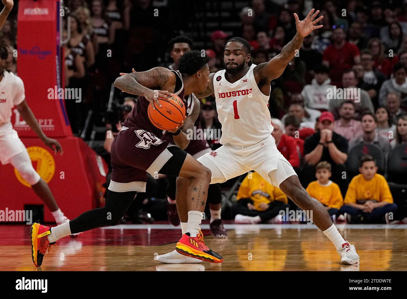 Houston guard Jamal Shead, right, defends Texas A&M guard Wade Taylor ...