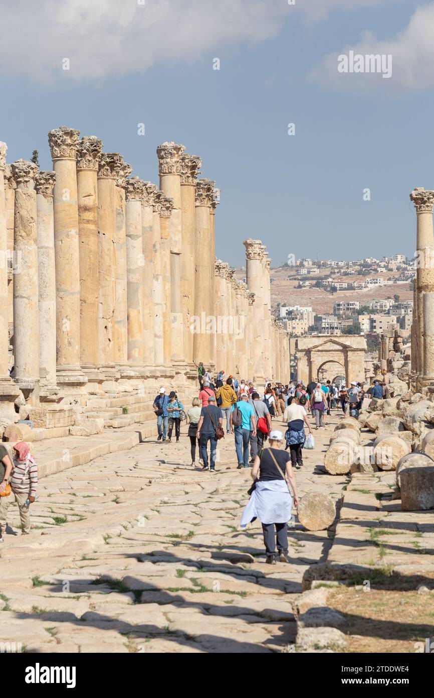 Tourists visiting the Jerash ruins during sunny day, Jordan Stock Photo ...